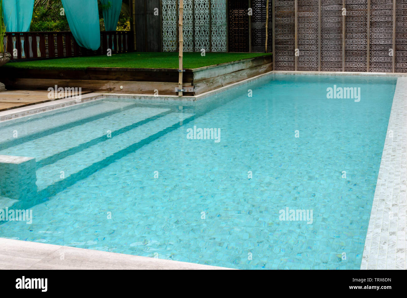 Swimming pool beautiful in tropical resort Stock Photo - Alamy