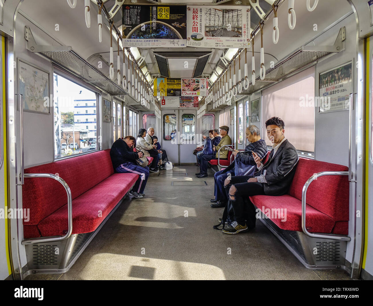 Tokyo, Japan - Apr 12, 2019. People sitting in JR subway train in Tokyo ...