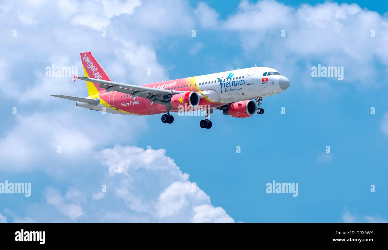 Passenger airplane Airbus A321 VietJet Air flying over urban areas ...