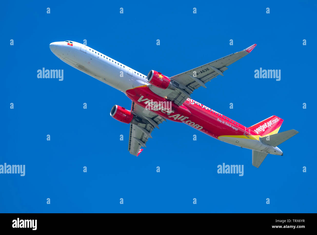 Passenger airplane Airbus A321 of VietJet Air flying through sky take ...