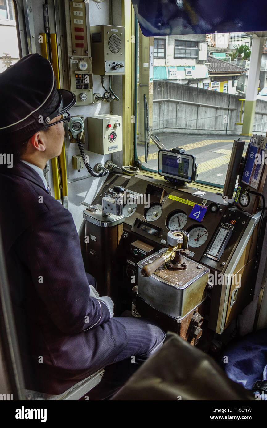 Osaka, Japan - Apr 12, 2019. Driver working in the cockpit of scenic ...