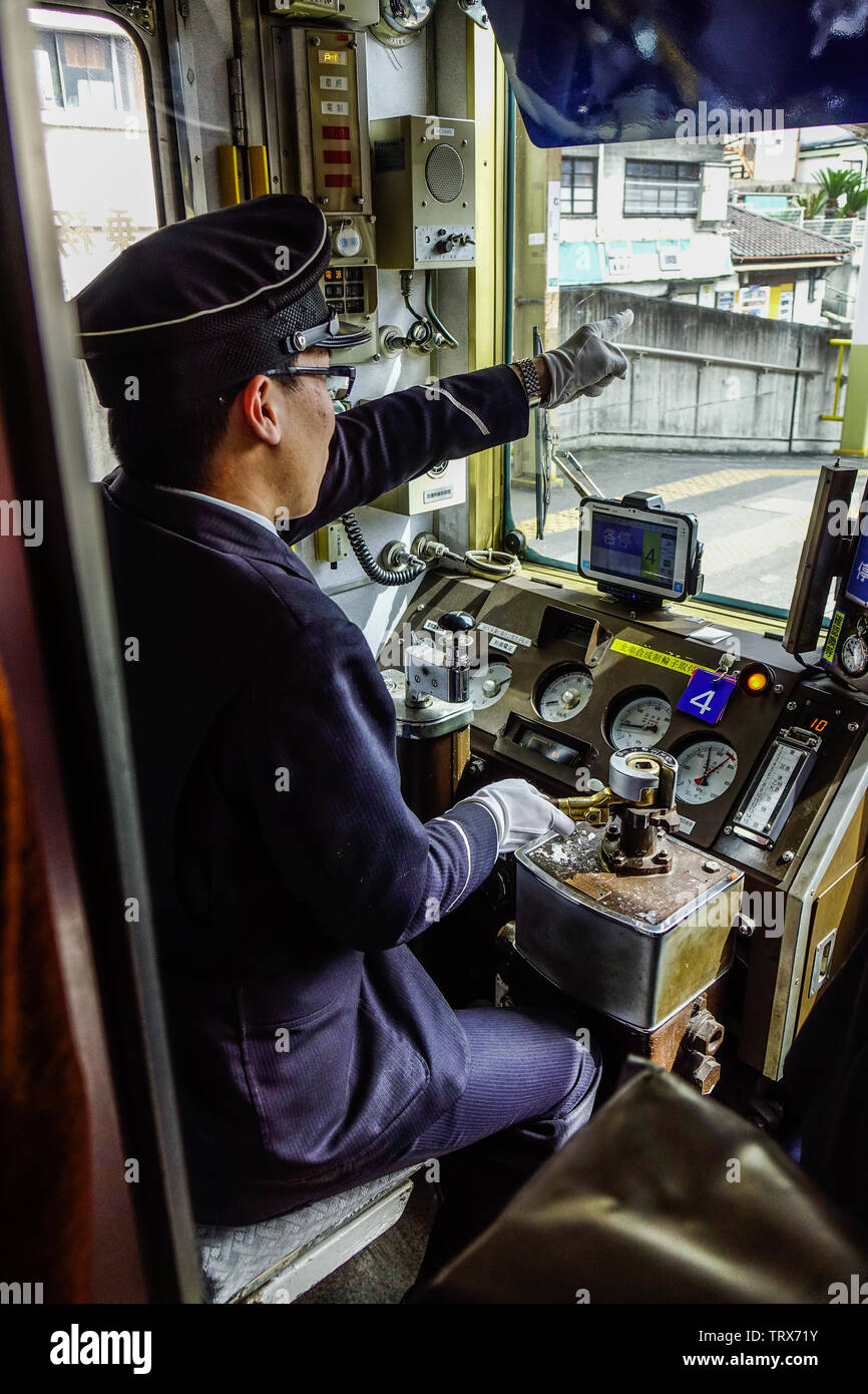Osaka, Japan - Apr 12, 2019. Driver working in the cockpit of scenic ...