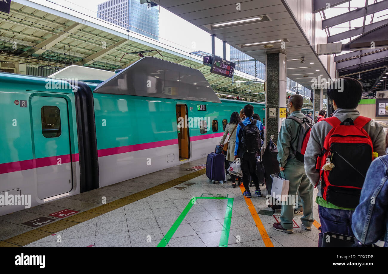 Tokyo, Japan - Apr 13, 2019. Passengers waiting for Shinkansen train at JR Station in Tokyo ...