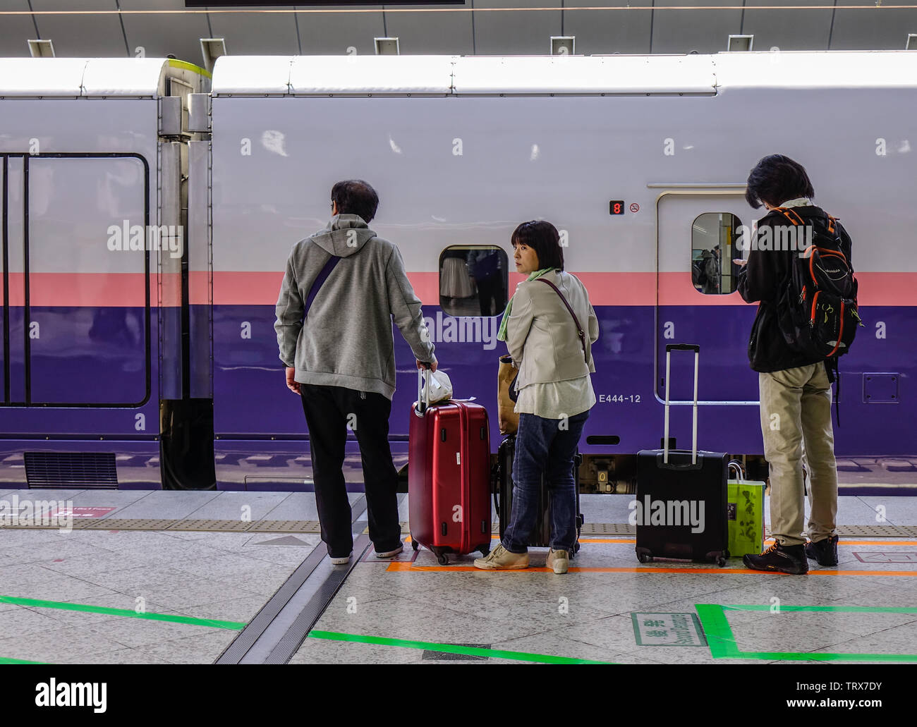 Tokyo, Japan - Apr 13, 2019. Passengers waiting for Shinkansen train at JR Station in Tokyo ...