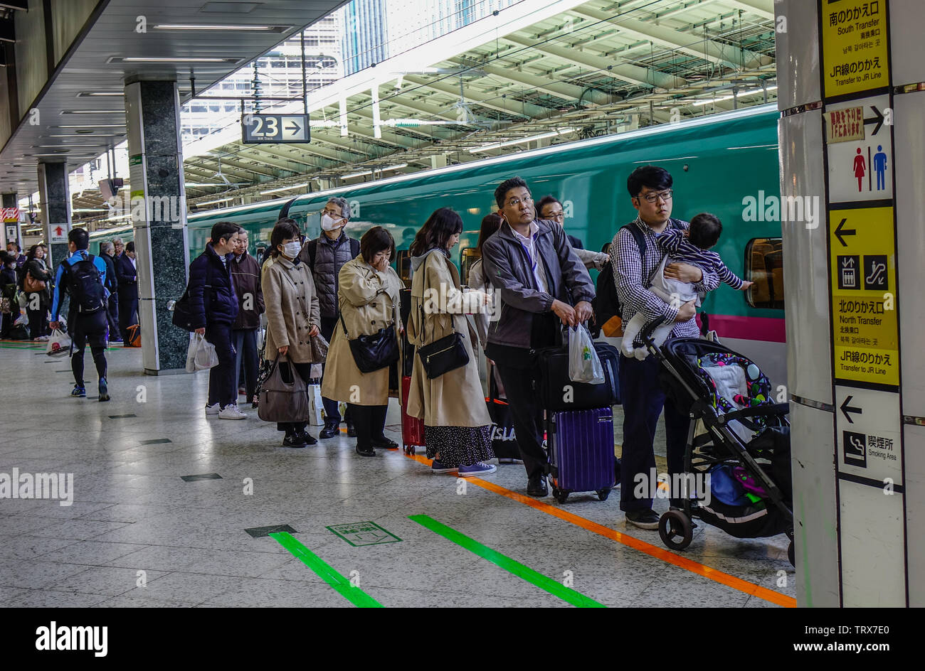 Tokyo, Japan - Apr 13, 2019. Passengers waiting for Shinkansen train at JR Station in Tokyo ...