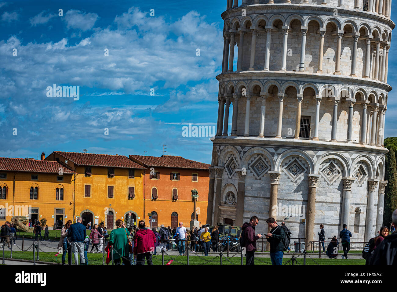 The Leaning Tower of Pisa surrounded by tourists, in Pisa, Tuscany ...