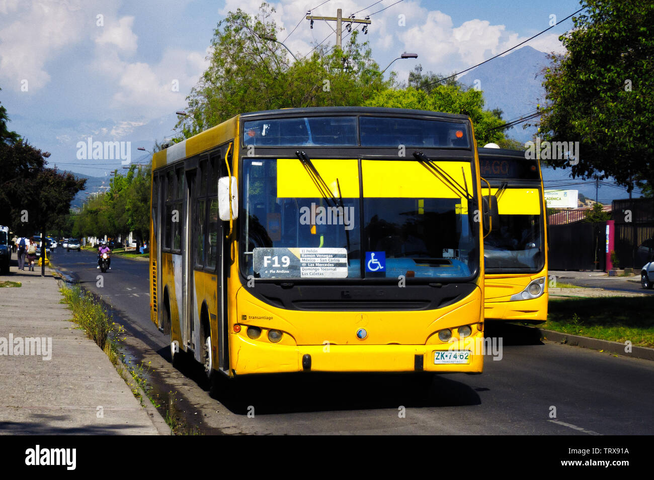SANTIAGO, CHILE - NOVEMBER 2014: Two buses in the middle of the route ...