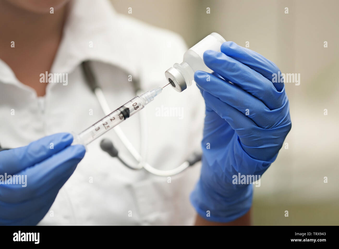 Medication nurse wearing protective gloves and white scrubs get a ...