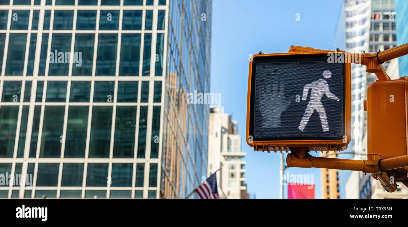 Walk traffic lights for pedestrians in New York city center, blur ...