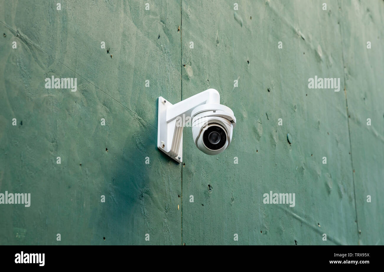 CCTV Security system. Surveillance Camera on a green color wall ...