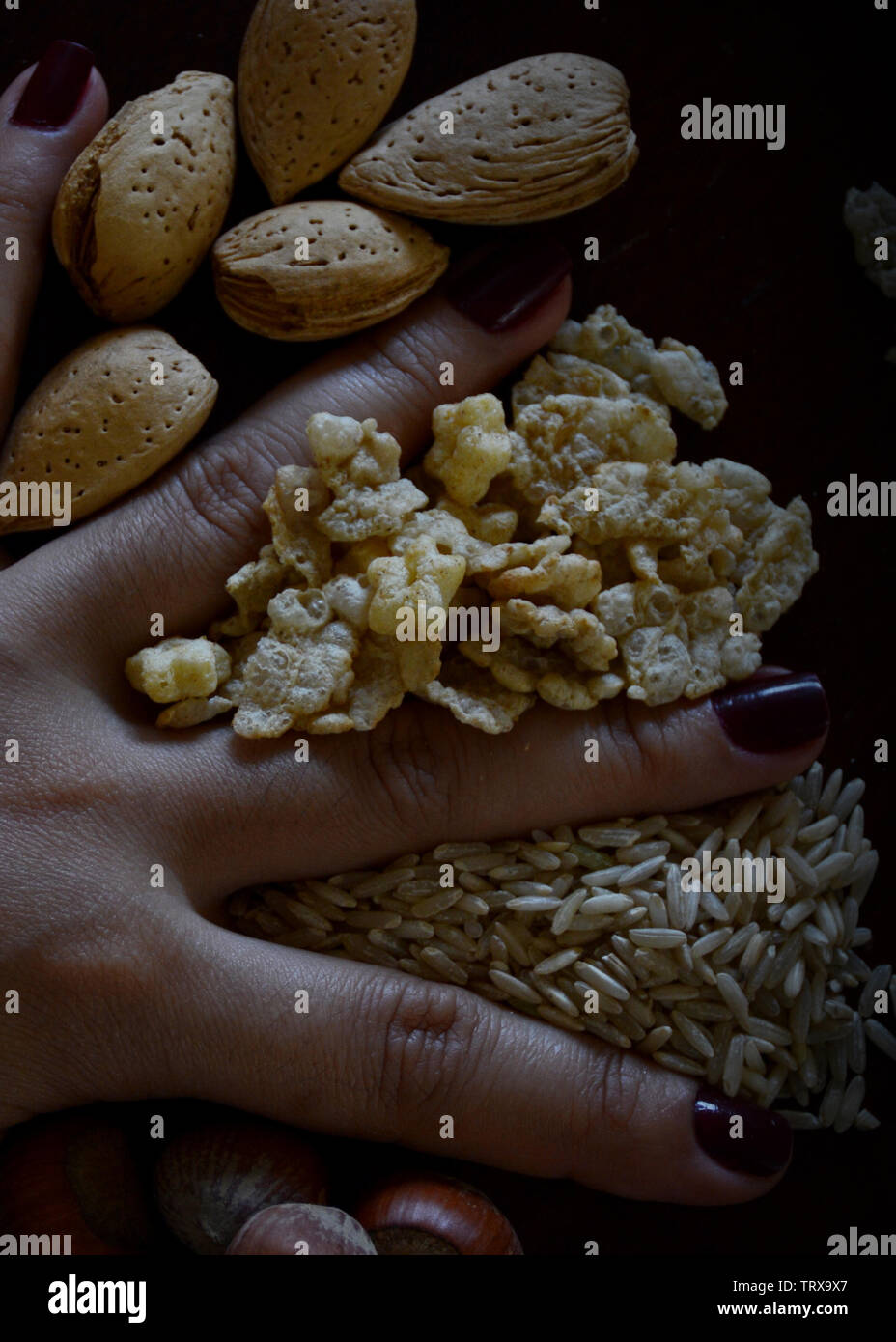 Nuts with womens hands hi-res stock photography and images - Alamy