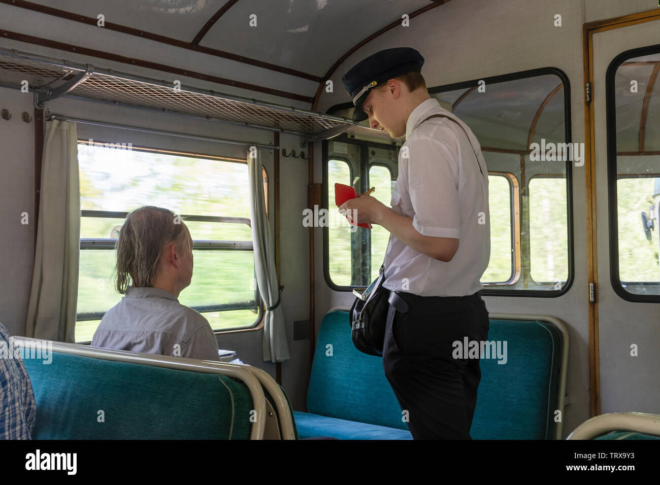 Train conductor tickets hi-res stock photography and images - Alamy