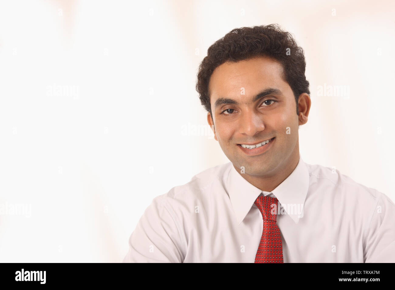 Portrait of an Indian businessman smiling Stock Photo - Alamy