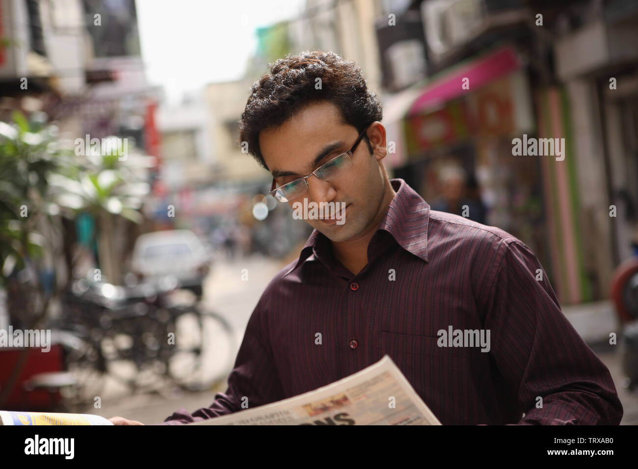 Man reading a newspaper Stock Photo - Alamy