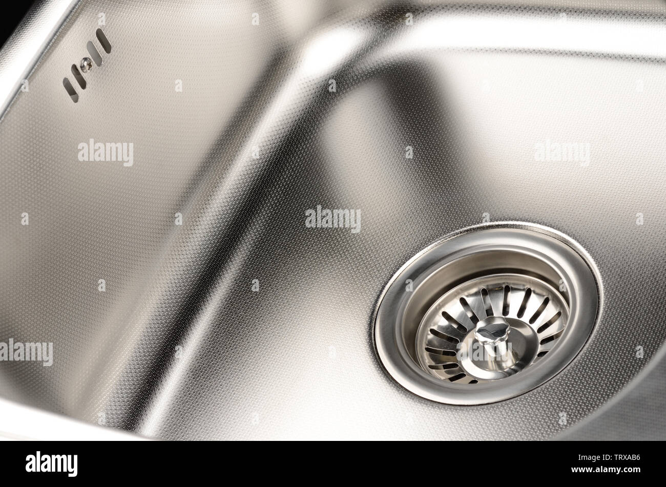 Stainless steel sink with drain. Closeup Stock Photo - Alamy