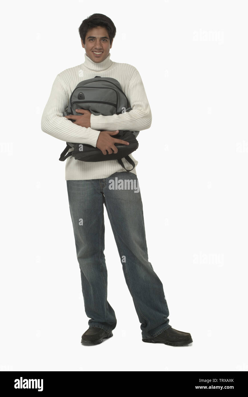 College student holding a book bag Stock Photo - Alamy