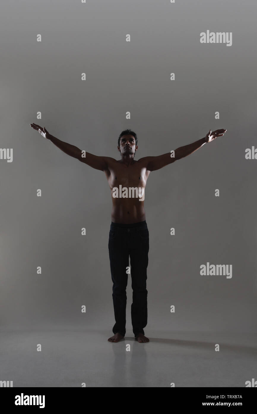 Man stretching his arms Stock Photo - Alamy