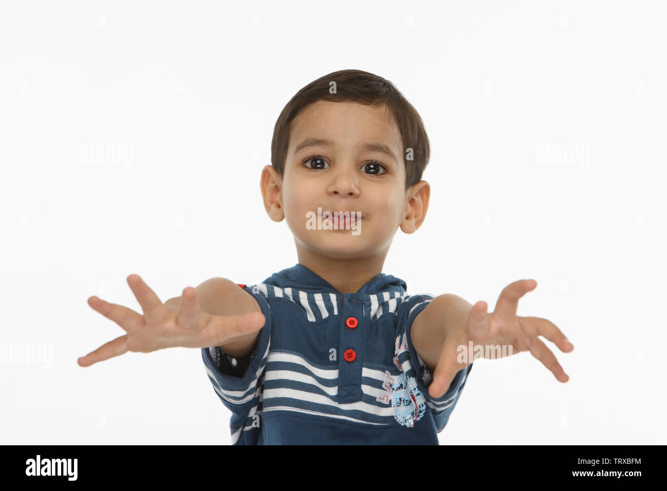 Portrait of a boy reaching out to camera Stock Photo - Alamy