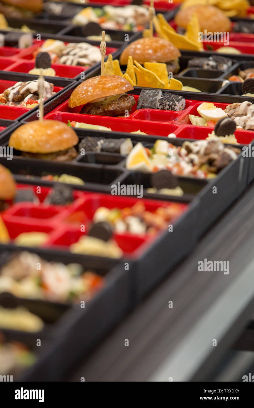 Mini burgers and bento boxes at corporate lunch event Stock Photo - Alamy