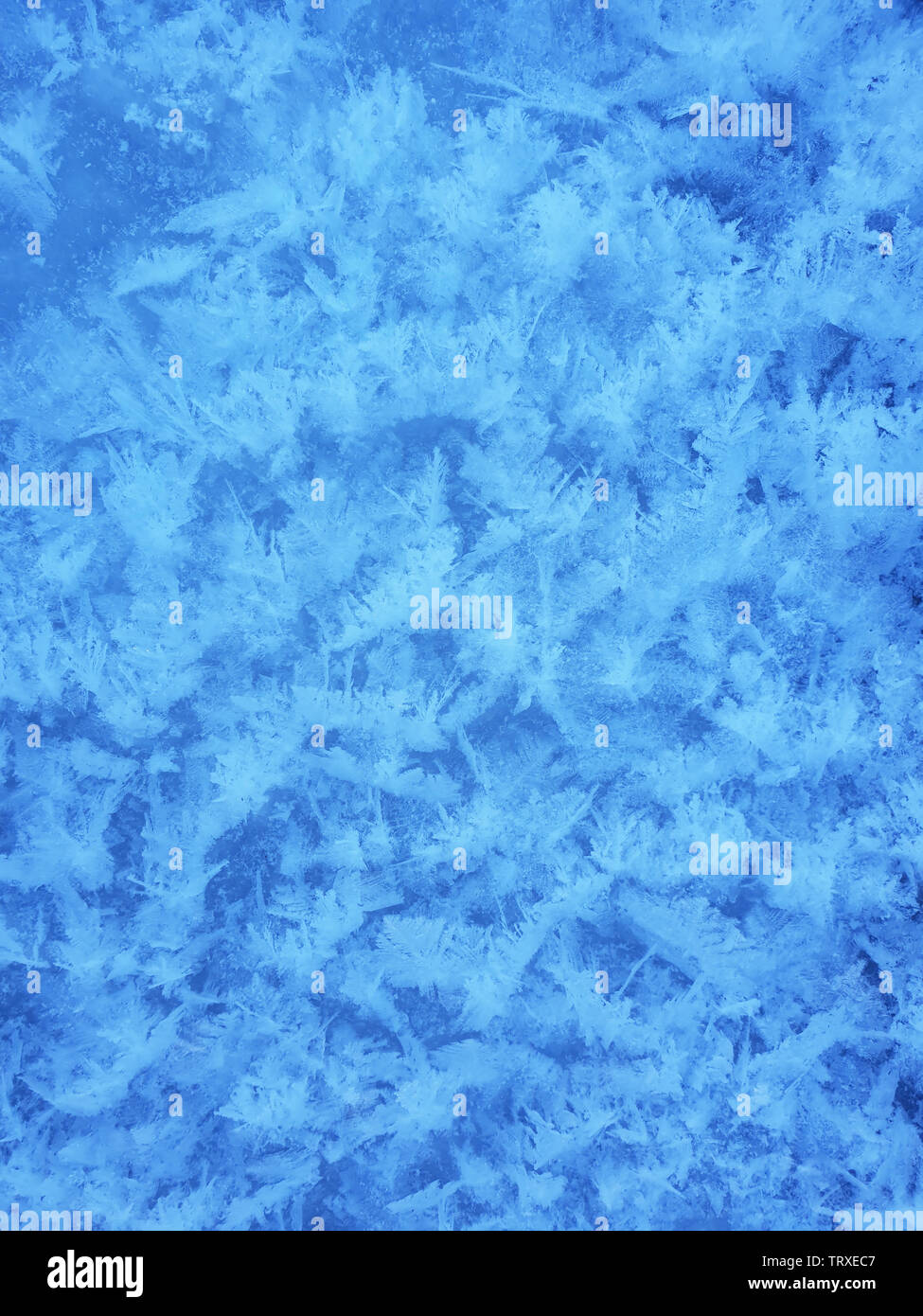 Snow crystals form beautiful snow pattern on frozen icy river ...