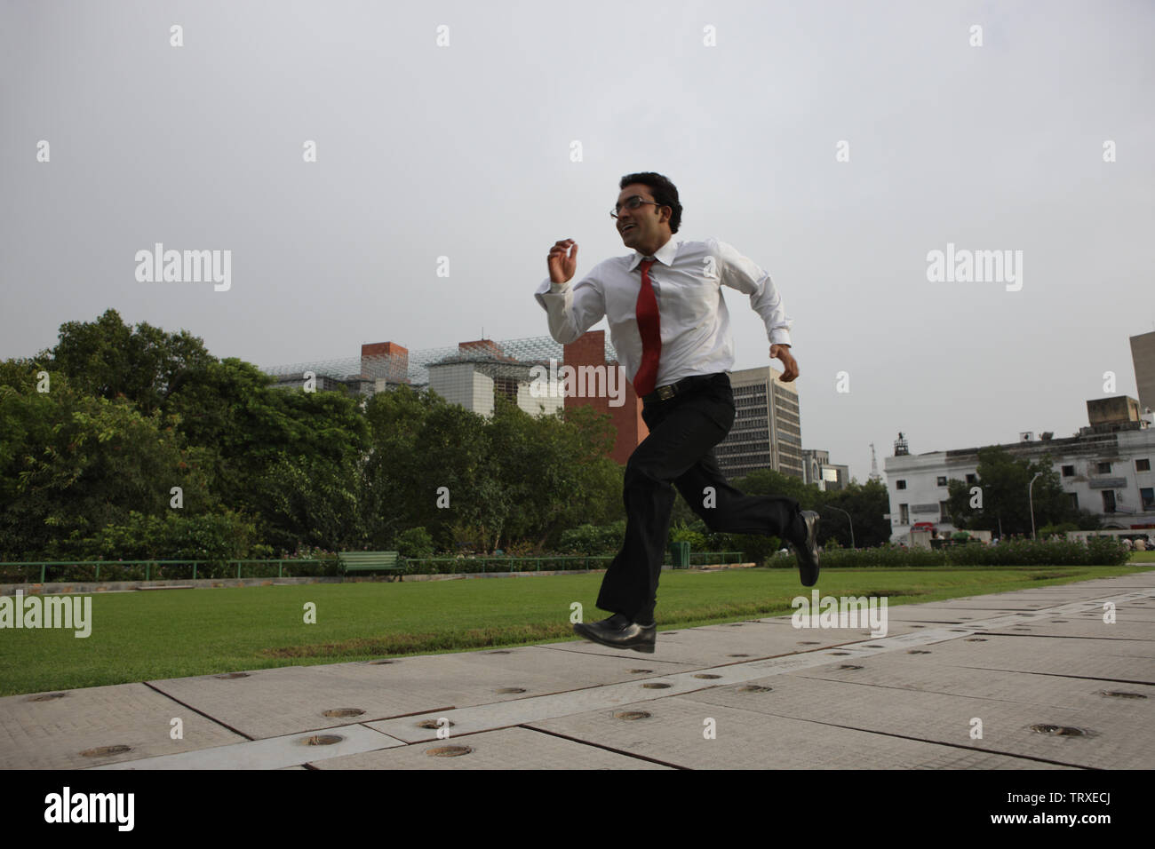 Indian businessman running hi-res stock photography and images - Alamy