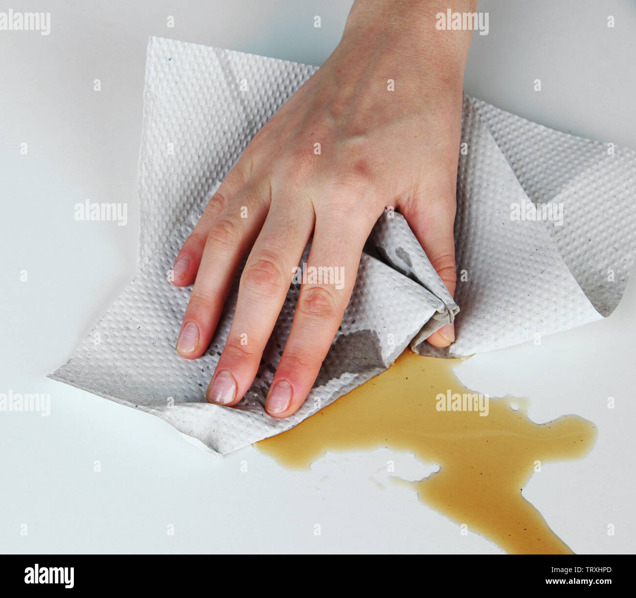 Hand wiping surface with paper napkin isolated on white Stock Photo - Alamy