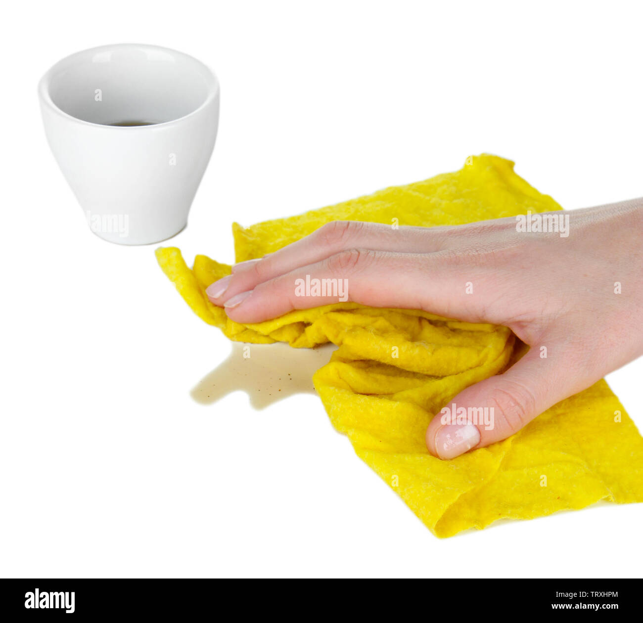 Hand wiping surface with yellow rag and cup of coffee isolated on white ...