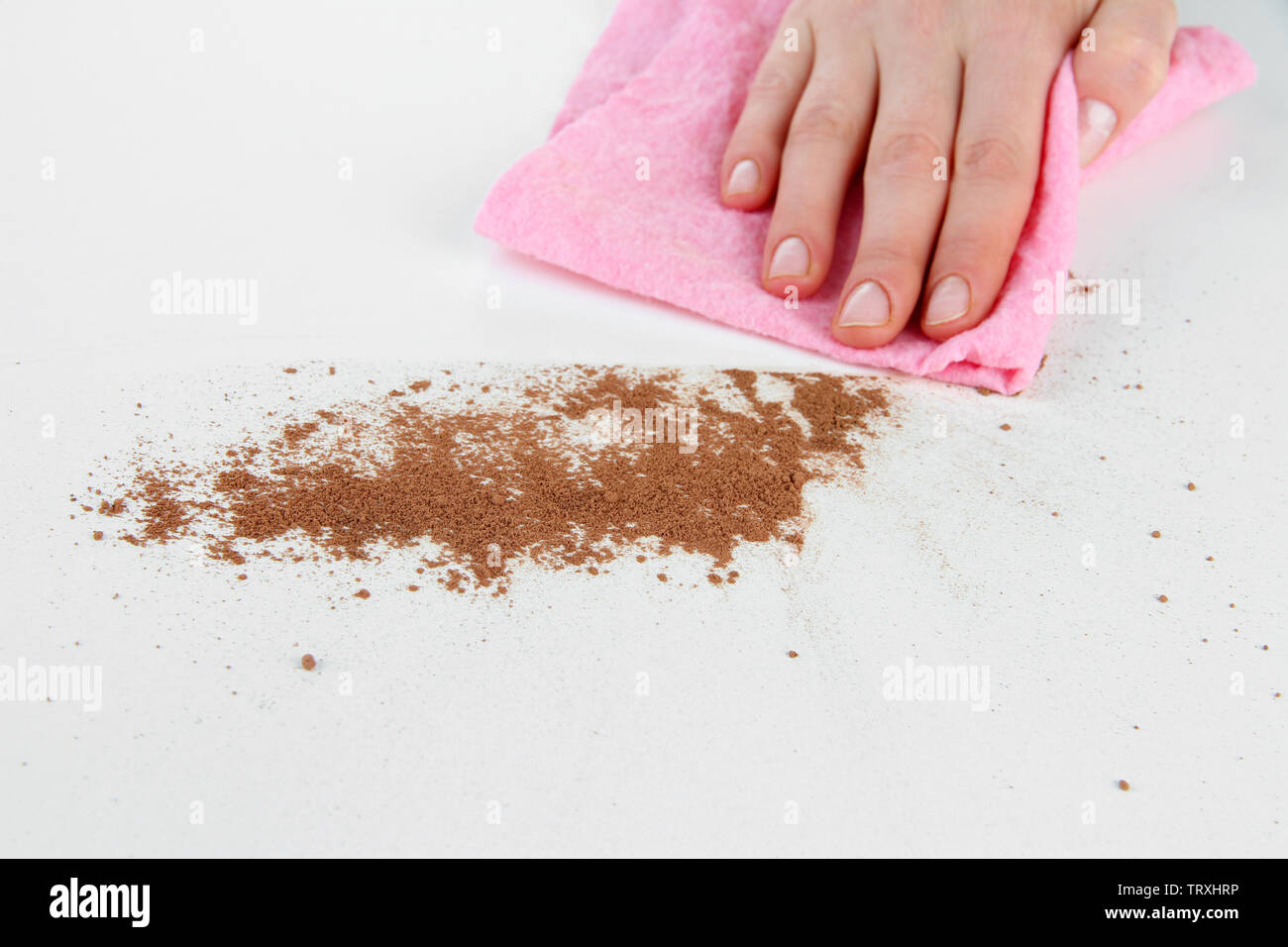 Hand wiping surface with pink rag isolated on white Stock Photo - Alamy