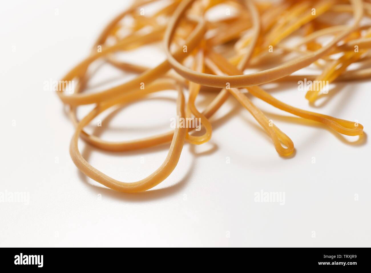 elastic rubber bands on a white table Stock Photo - Alamy