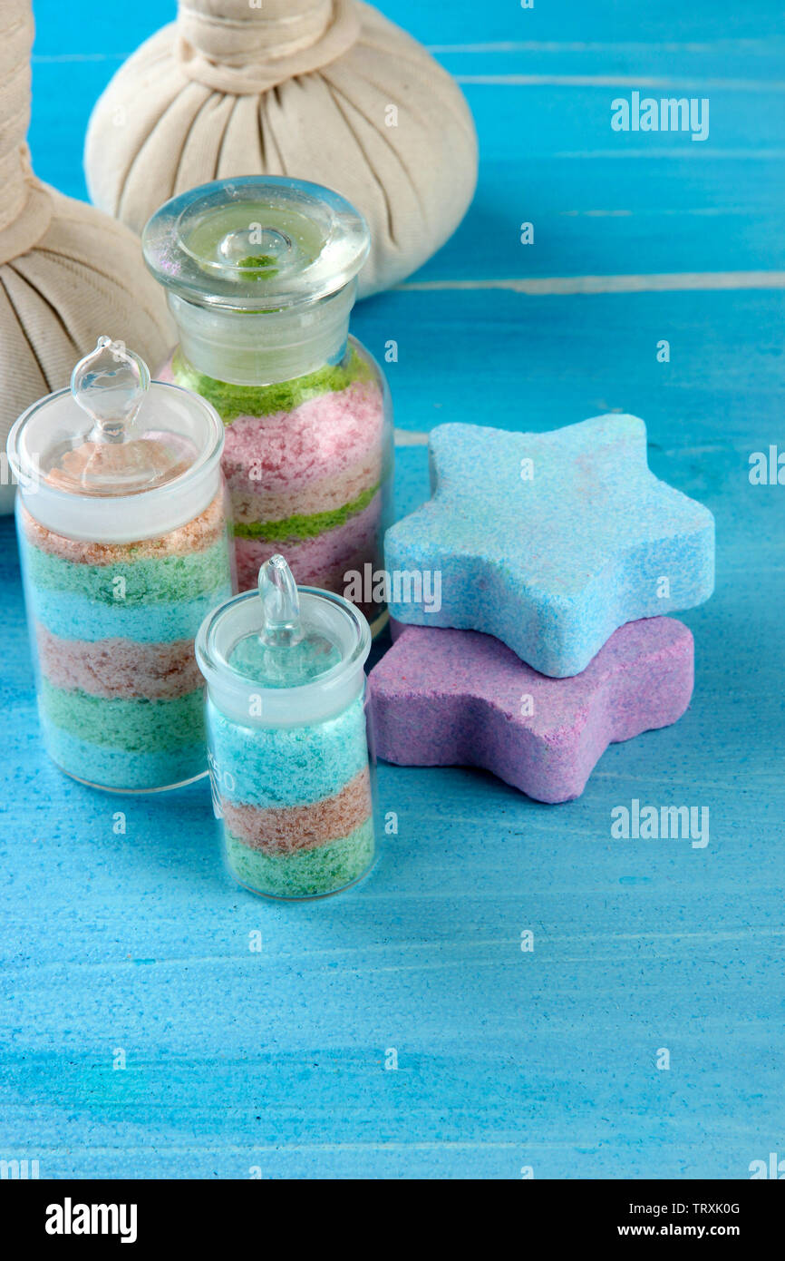 Aromatic salts in glass bottles and herbal compress balls for spa ...
