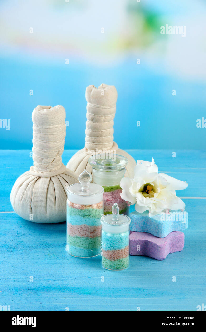 Aromatic salts in glass bottles and herbal compress balls for spa ...