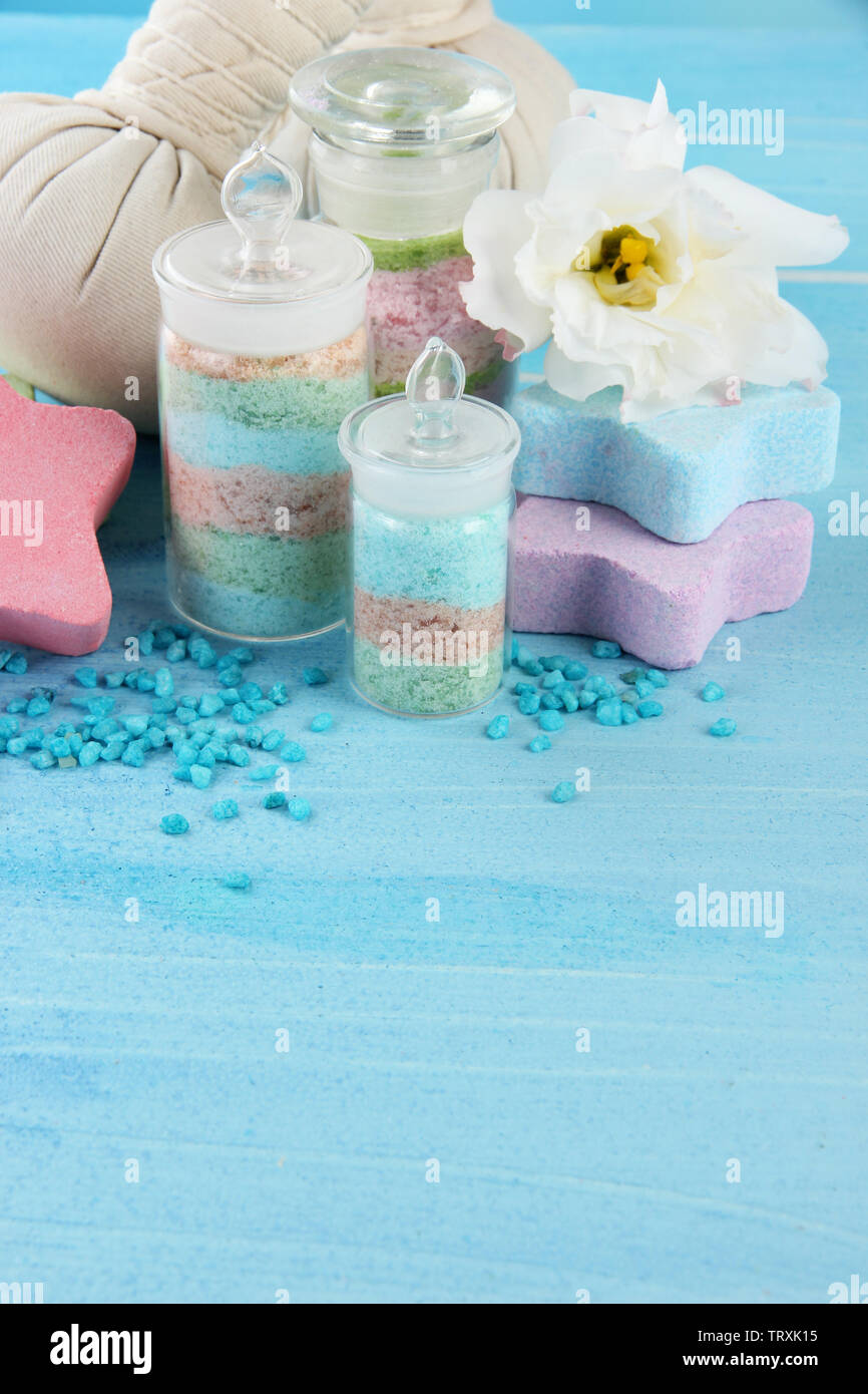 Aromatic salts in glass bottles and herbal compress balls for spa ...