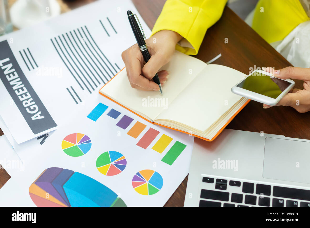 a businesswoman working plan the business and analysis many chart graph ...