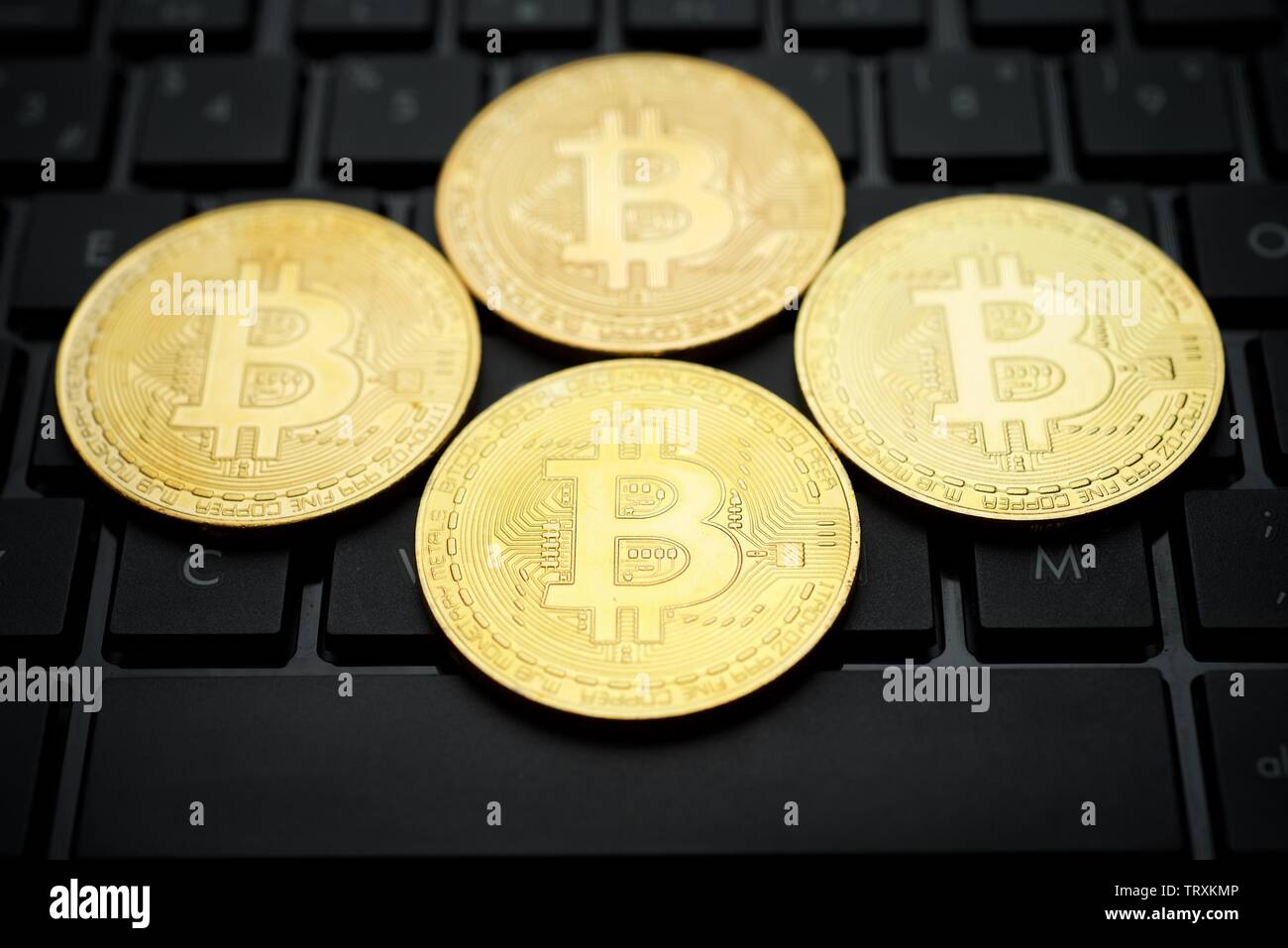 Bitcoins on a keyboard computer Stock Photo - Alamy