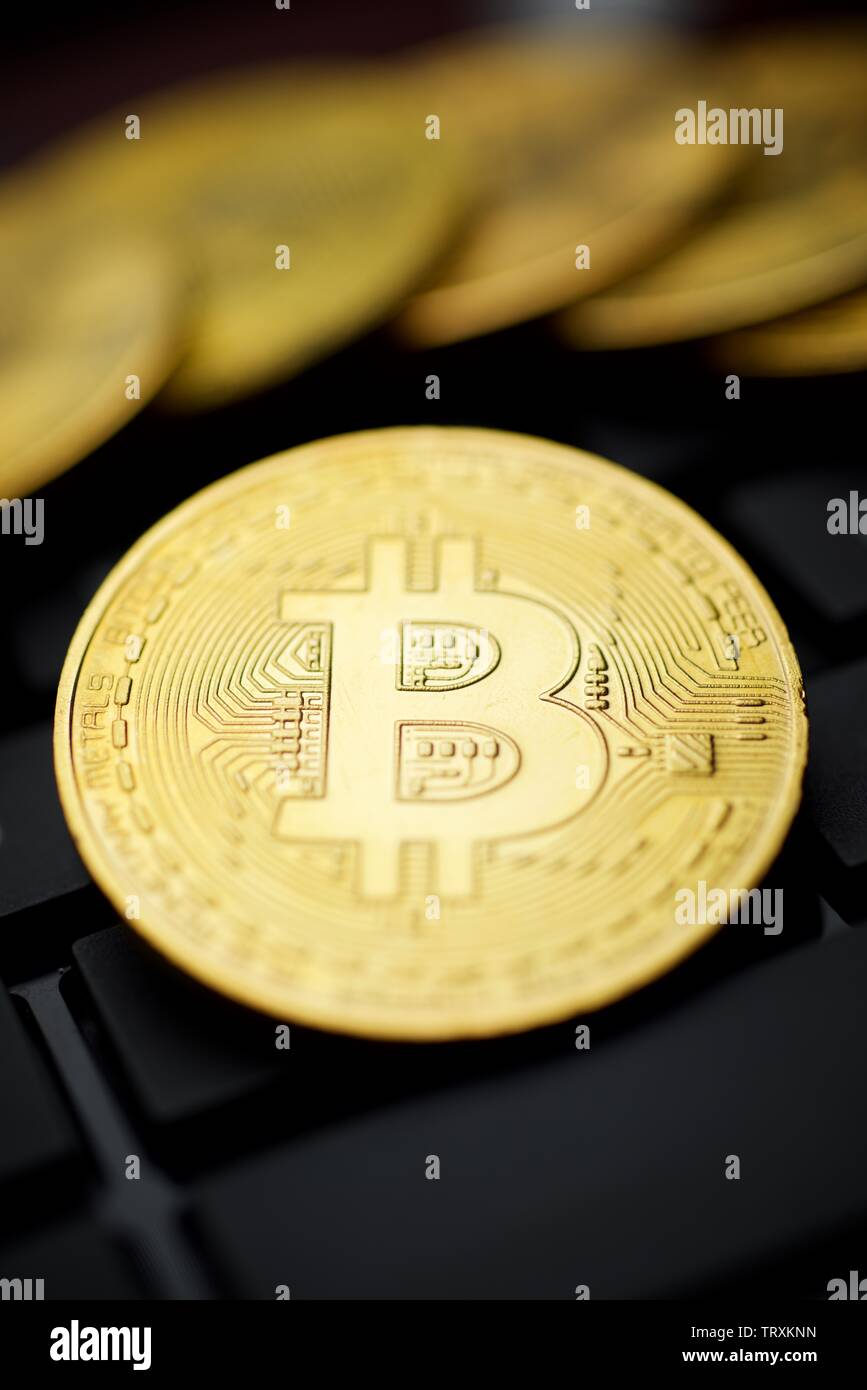 Bitcoins on a keyboard computer Stock Photo - Alamy