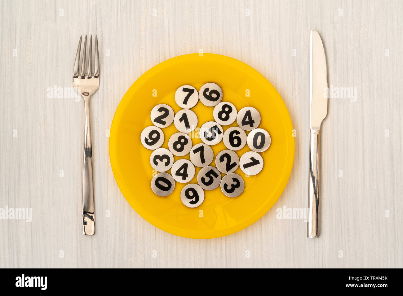 Fork, knife and plate with numbers. Hungry for knowledge, brain feeding ...