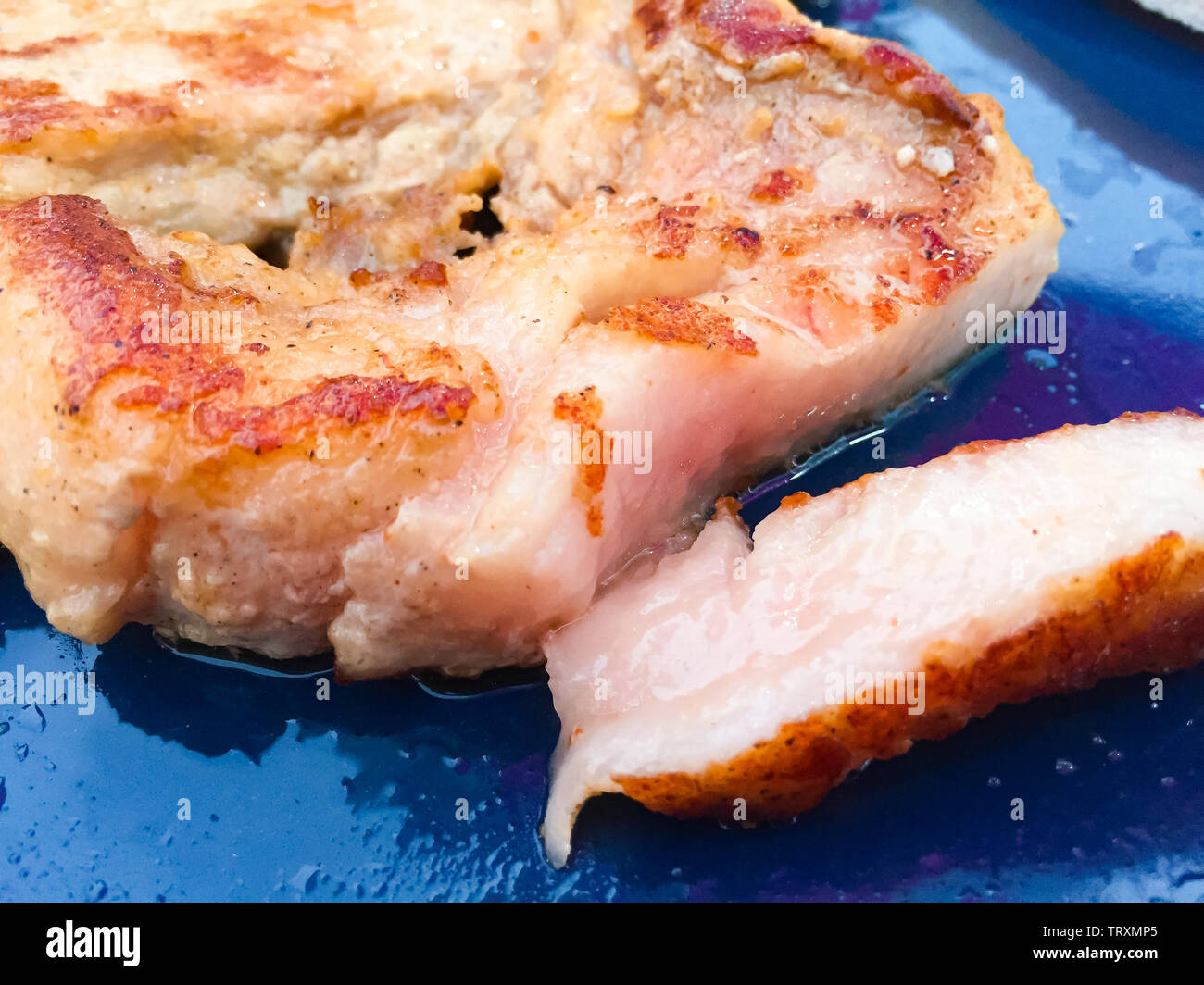 Grilled Pork chop Steak with gravy sauce. it show the texture of the ...