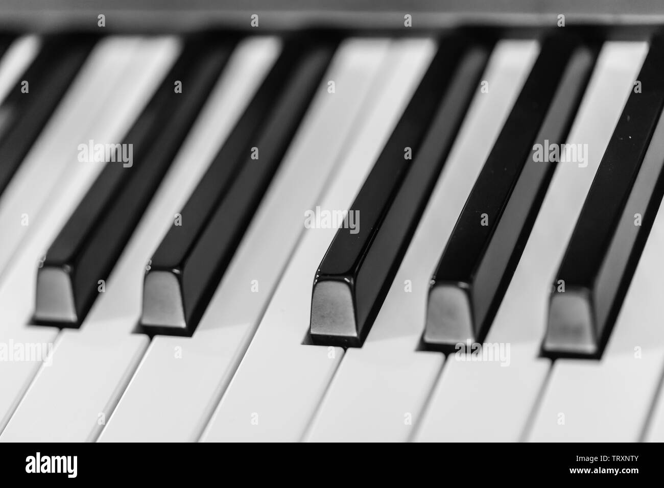 Piano keyboard background. Piano keys side view Stock Photo - Alamy