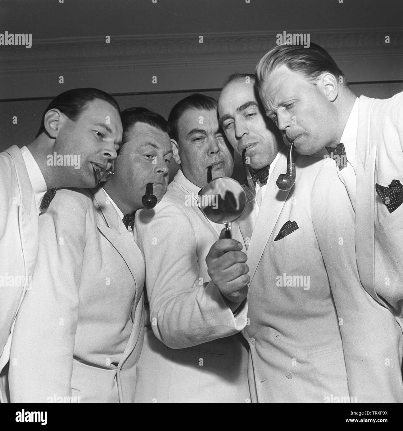 Men wearing suits man wearing a suit Black and White Stock Photos ...
