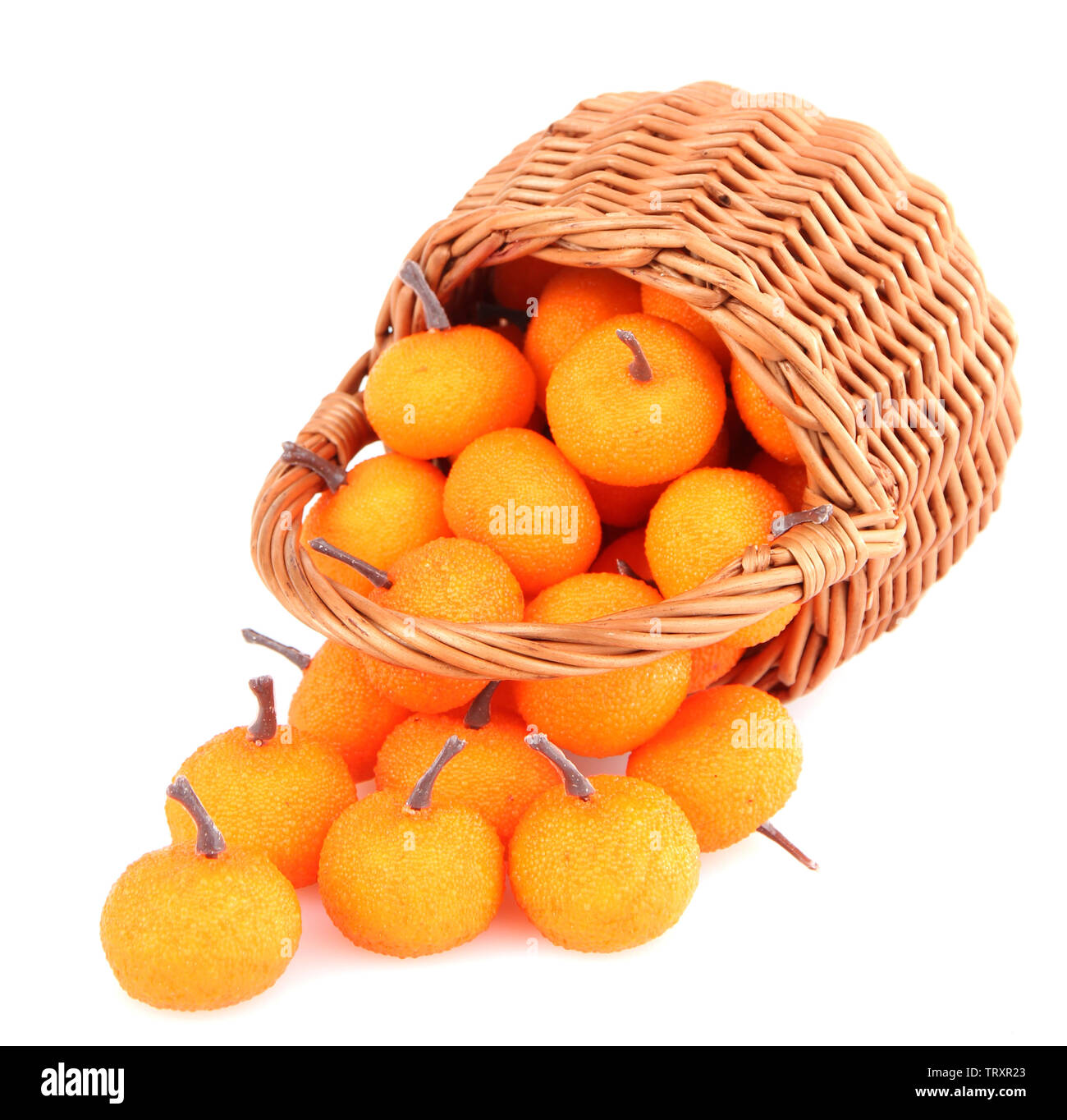 Small tangerines in wicker basket, isolated on white Stock Photo - Alamy