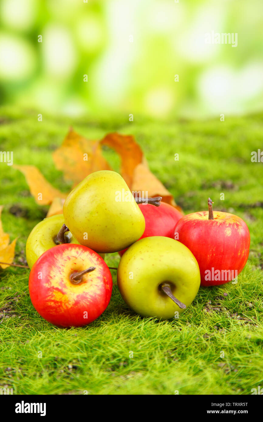 Small apples on nature background Stock Photo - Alamy