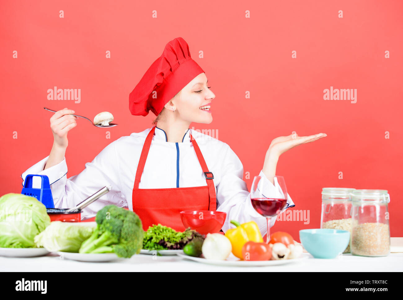 Cooking meal. Woman chef try taste eat food. Delicious recipe concept ...