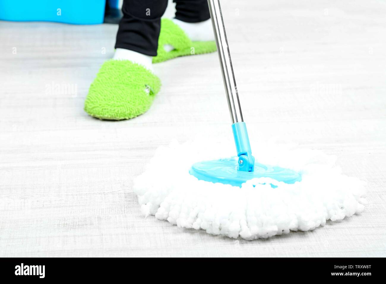 Mopping floor at home close-up Stock Photo - Alamy