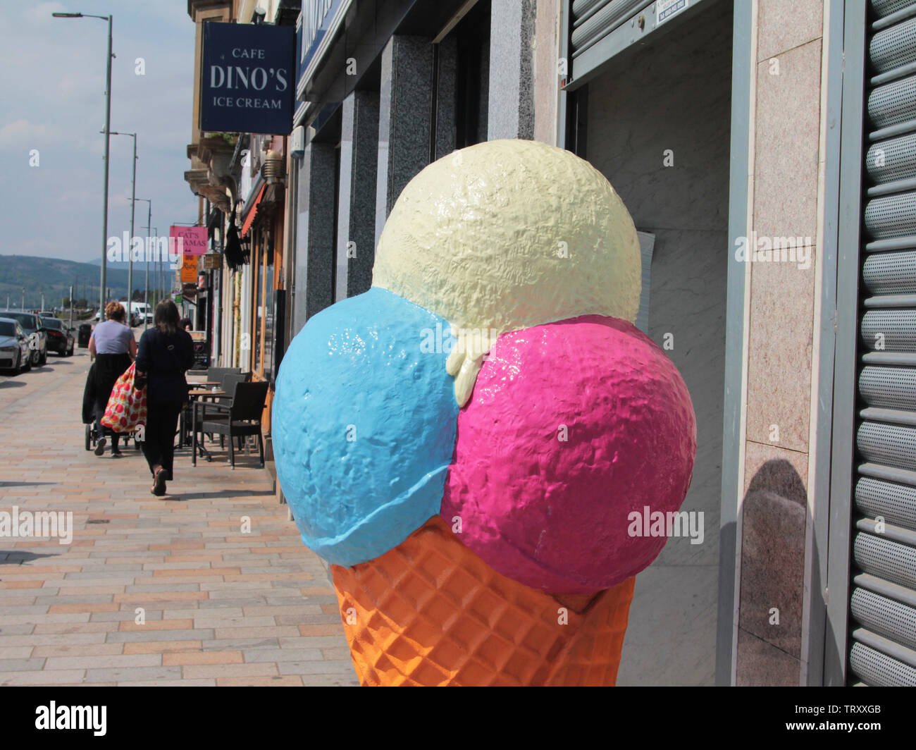 A huge, colourful ice cream cone sits outside a café in the holiday ...