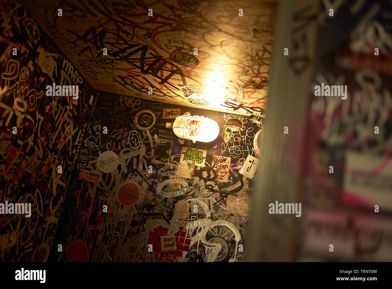 Interior of the walls full of graffiti in an old pub bar in the city ...
