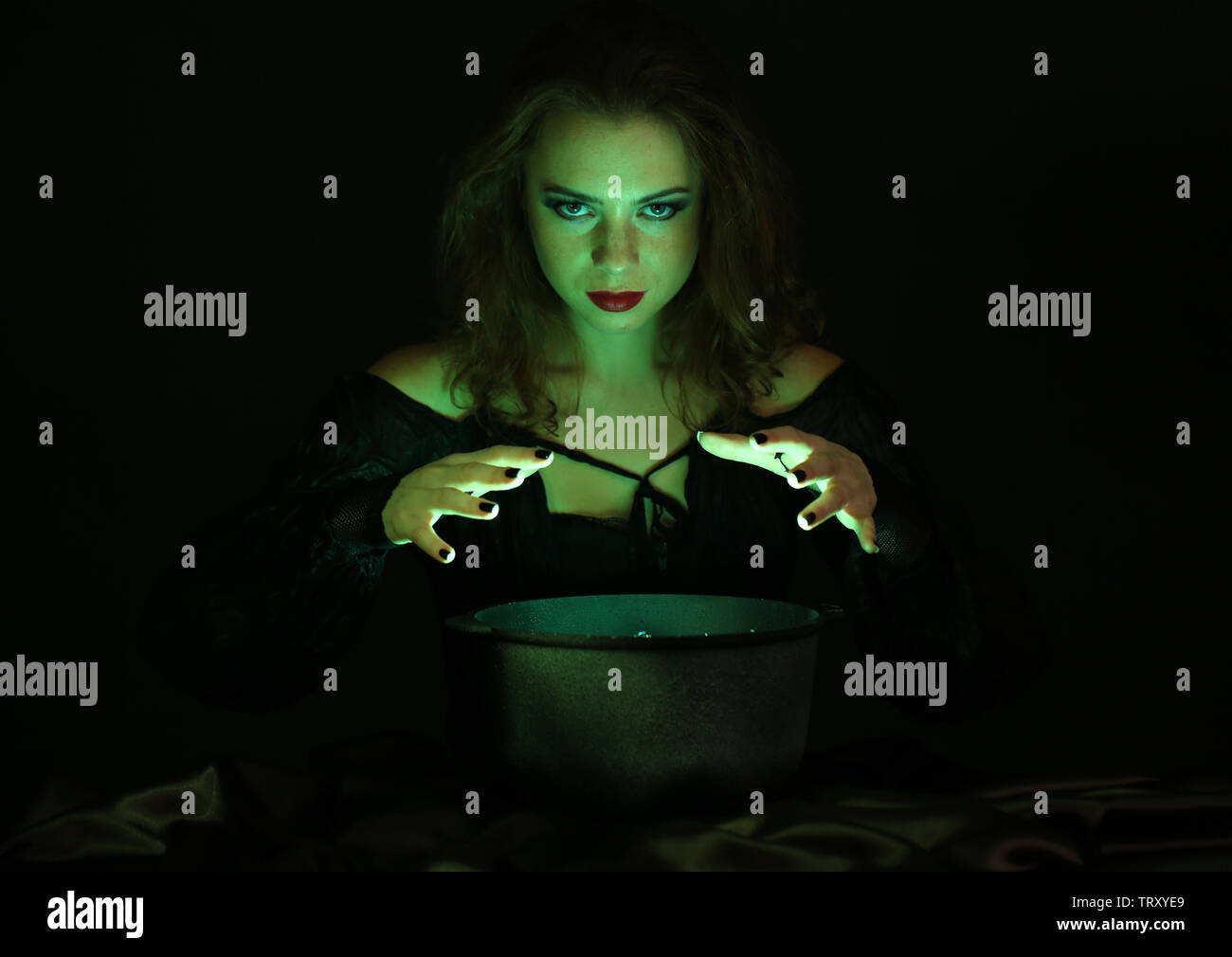 Halloween witch on black background Stock Photo - Alamy