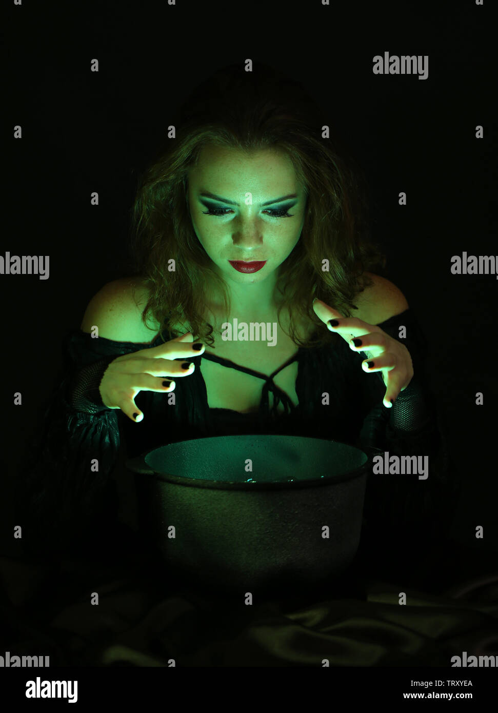 Halloween witch on black background Stock Photo - Alamy