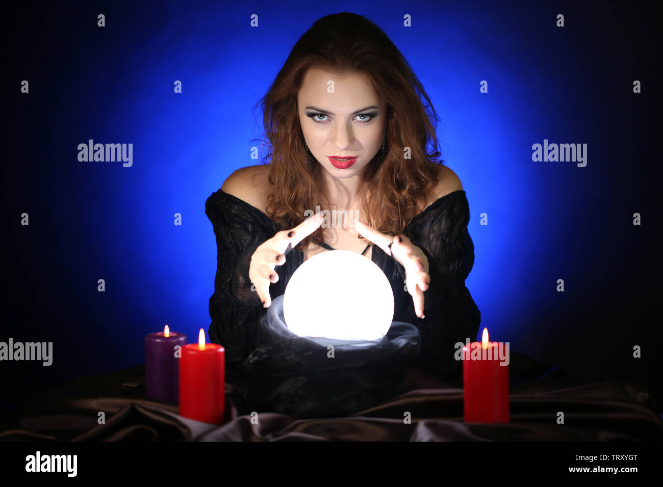 Halloween witch on dark blue background Stock Photo - Alamy