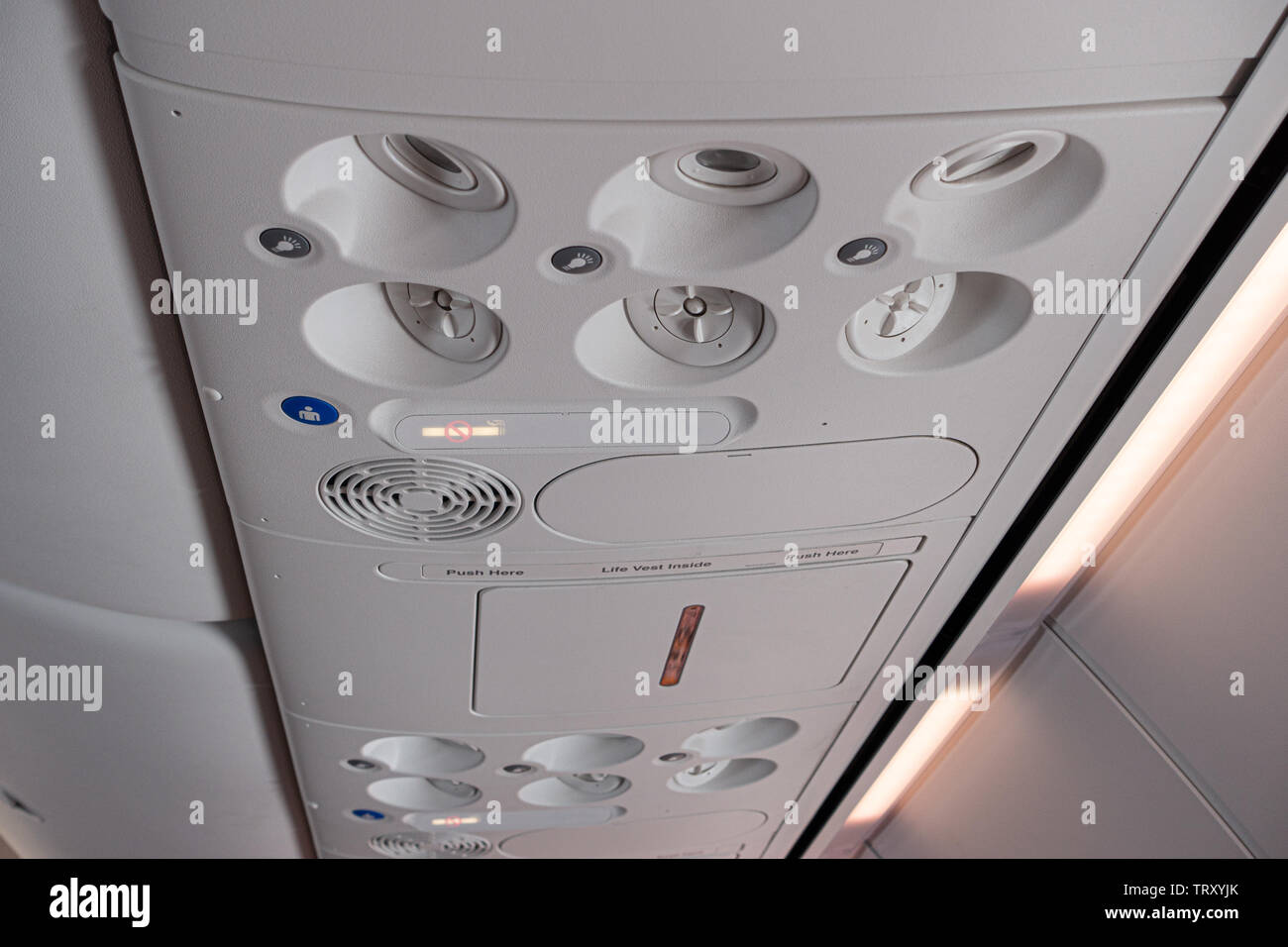 Overhead ceiling panels with lighting and air conditioning controls on ...