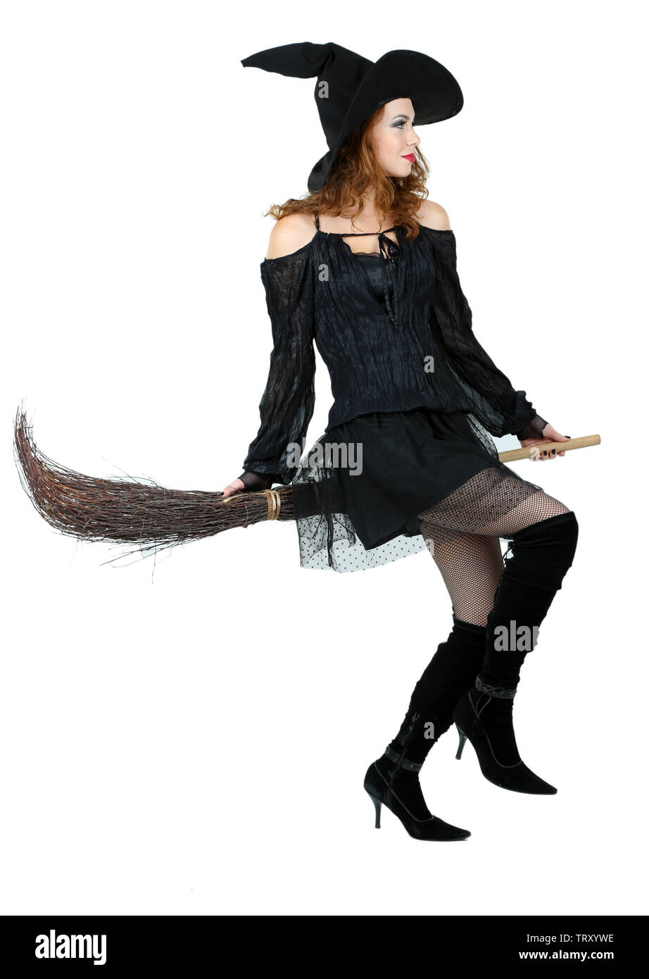 Halloween witch with broom isolated on white Stock Photo - Alamy